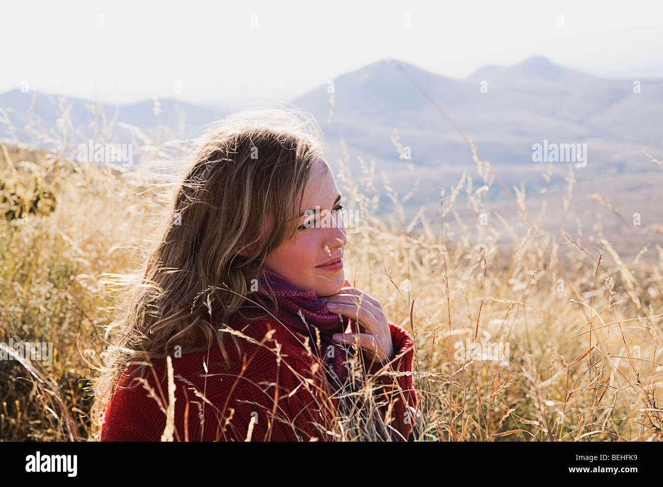 Side profile of a young woman thinking Stock Photo - Alamy