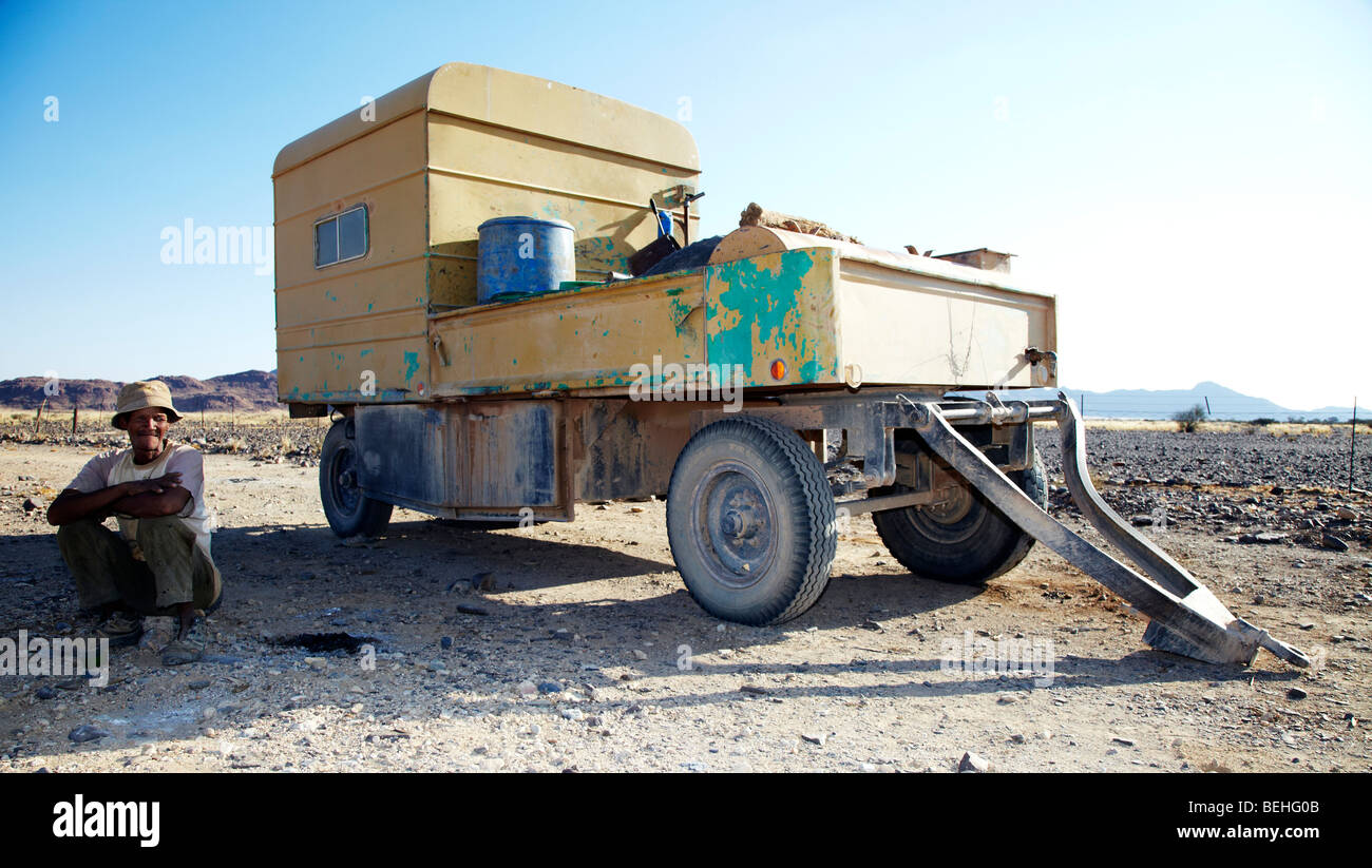 Namibian man, Namibian man sitting at roadside Stock Photo - Alamy