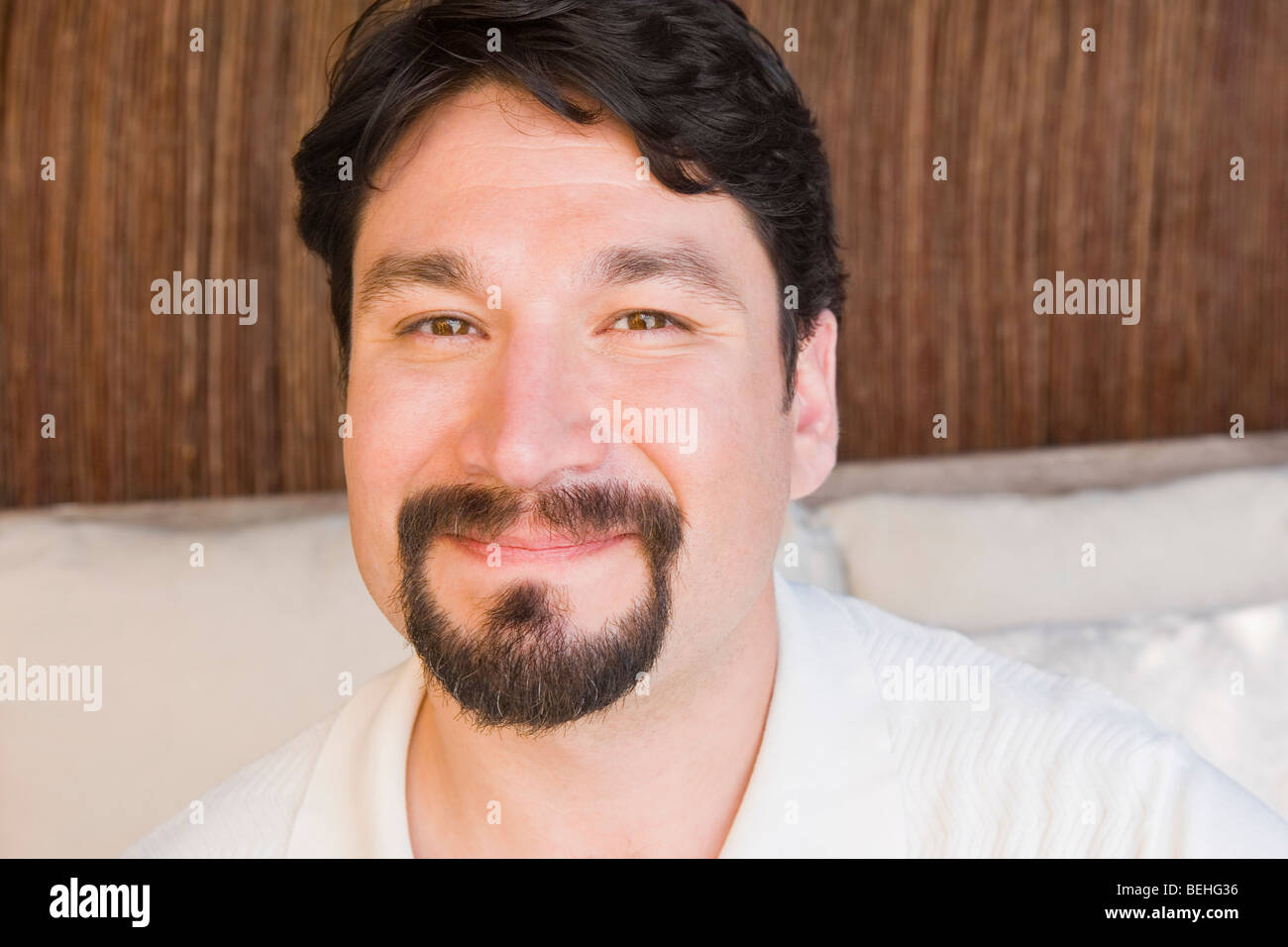 Portrait of a mid adult man smirking Stock Photo - Alamy