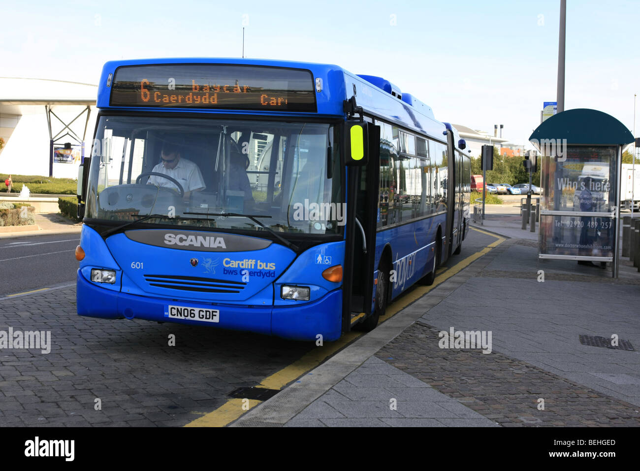 Scania blue Bendy-Bus in Cardiff City Wales Stock Photo - Alamy