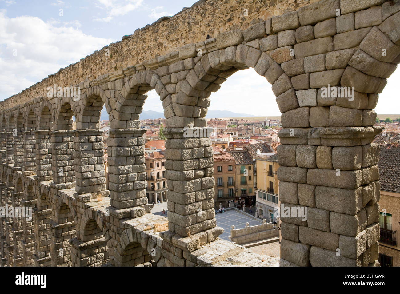 Roman water aqueduct, elevated view with city background, Segovia ...