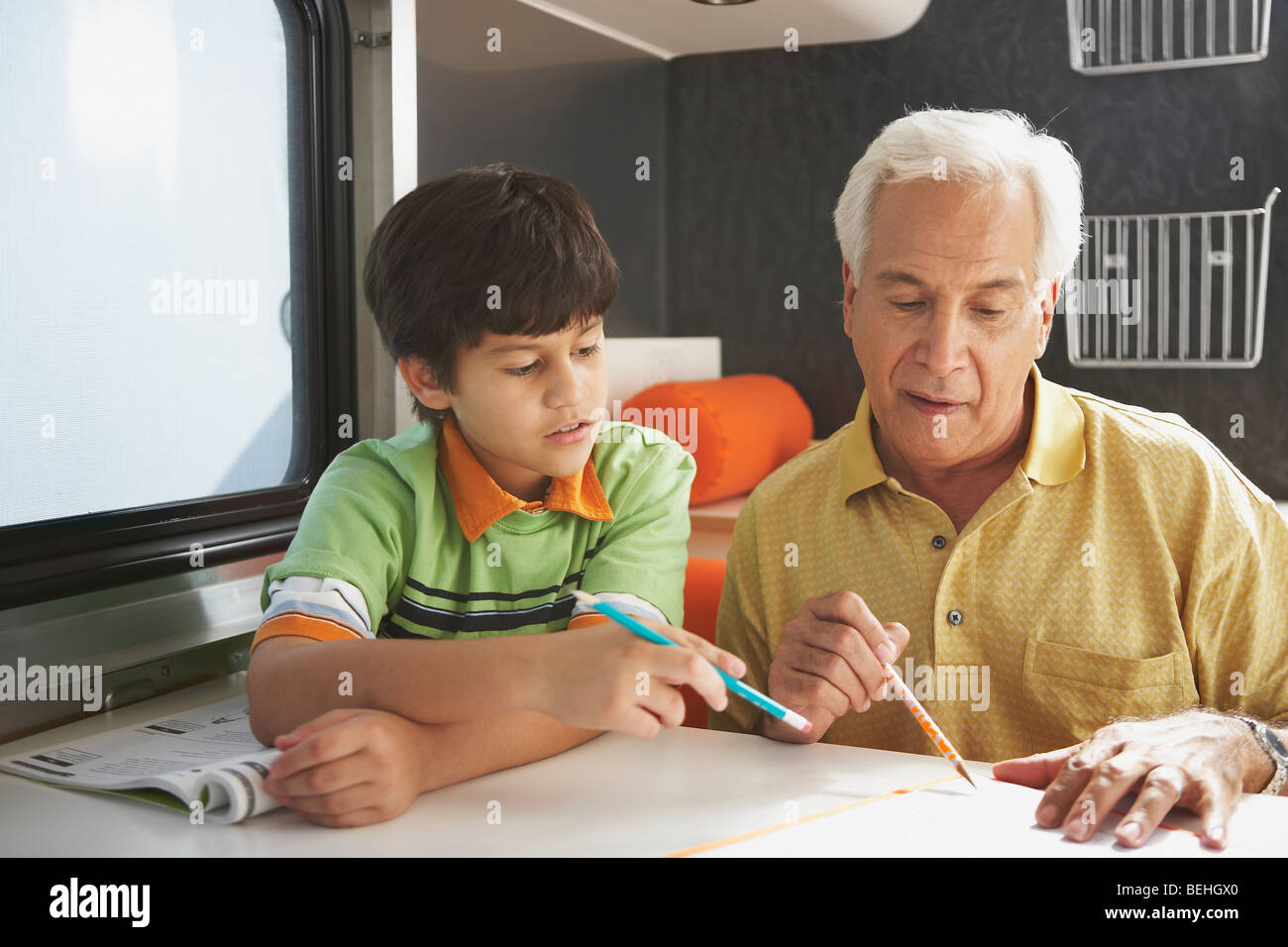 Senior man teaching his grandson Stock Photo - Alamy