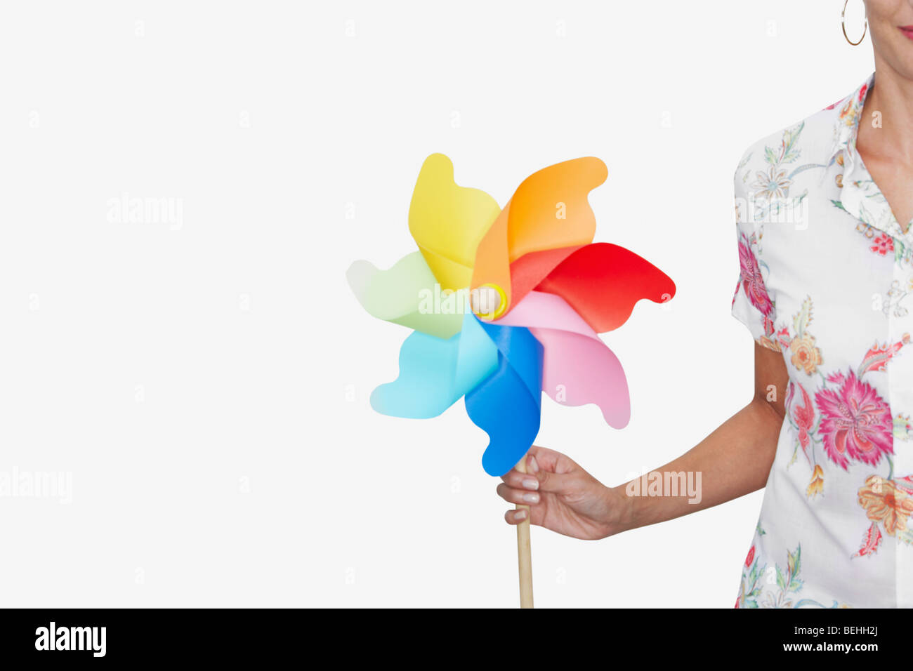 Mid section view of a woman holding a pinwheel Stock Photo - Alamy