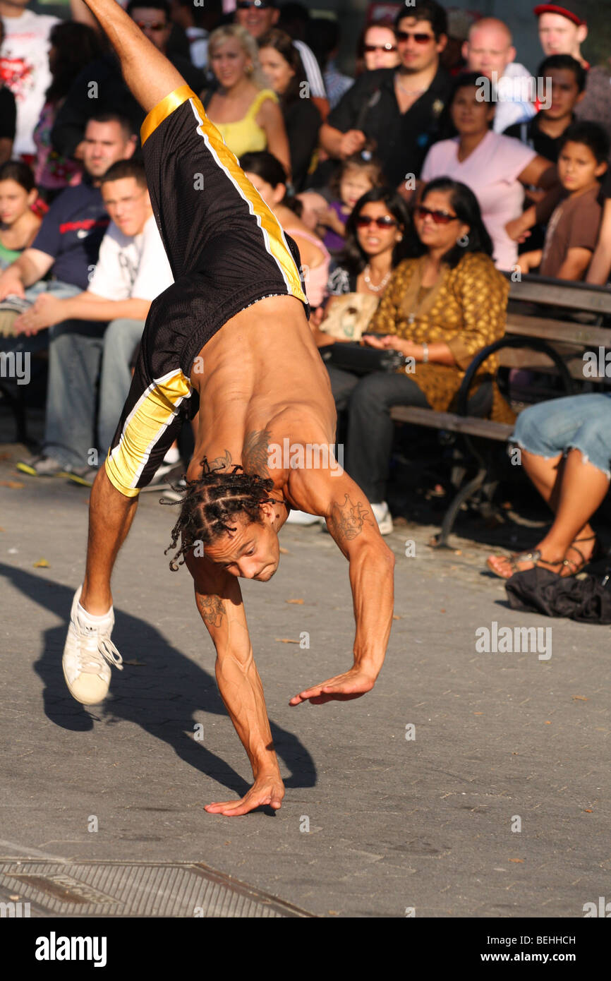 Acrobats in Battery Park New York. Street dances performing in the park ...
