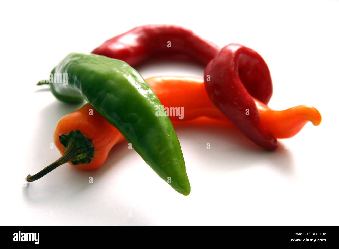 Cutout of an assortment of long hot peppers on white background Stock ...