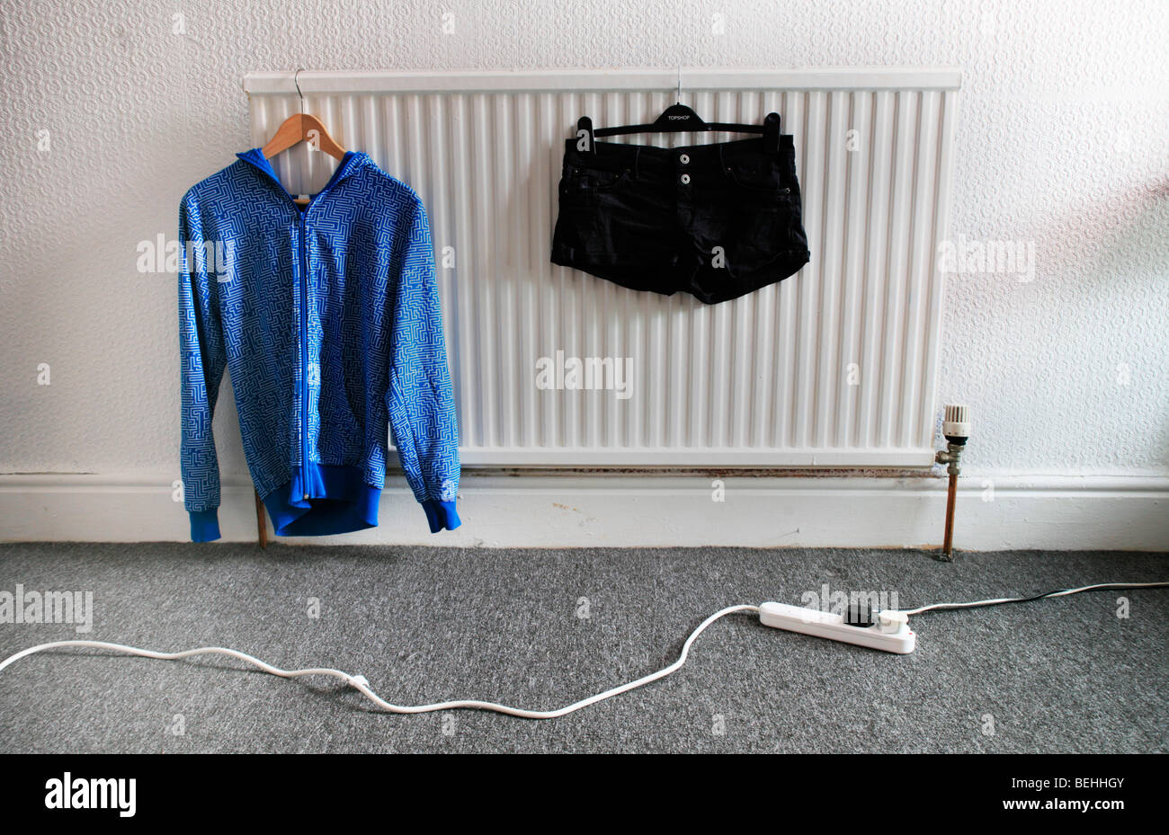 Teenage Girl's Clothes Hanging on a Radiator Stock Photo - Alamy