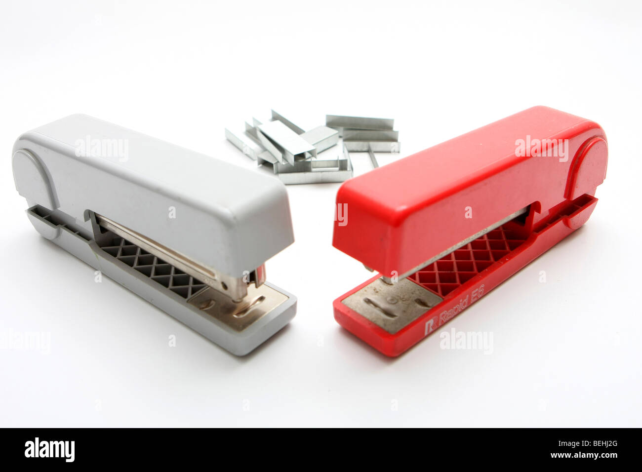 Cutout of a Stapler and pins on white background Stock Photo - Alamy