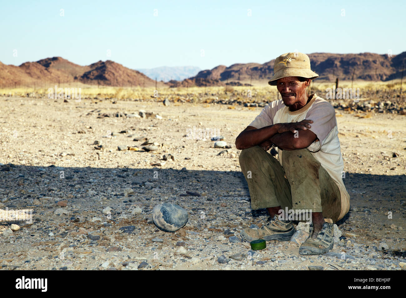 Namibian man, Namibian man sitting at roadside Stock Photo - Alamy