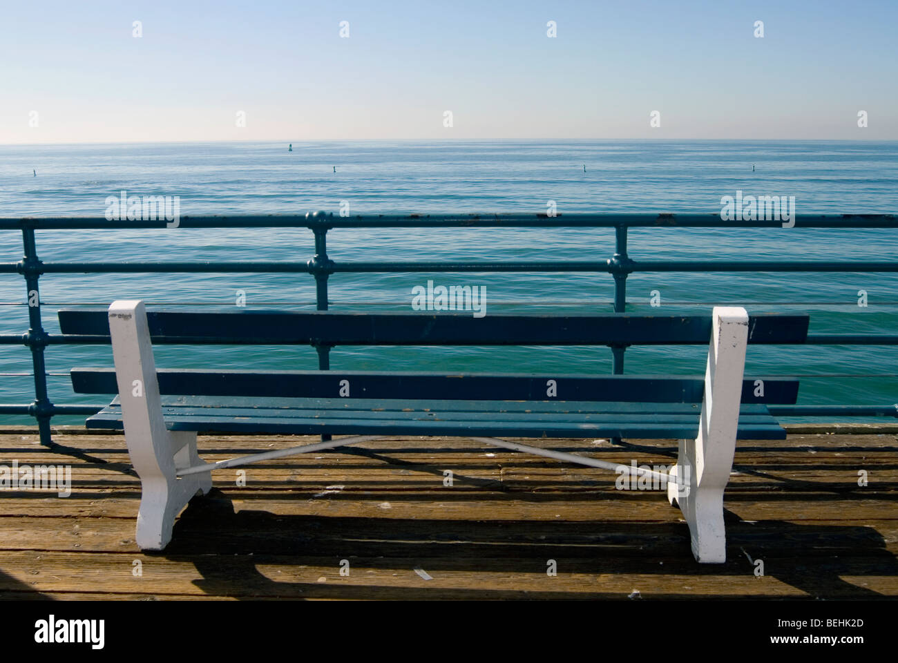 Bench overlooking the ocean on pier Stock Photo - Alamy