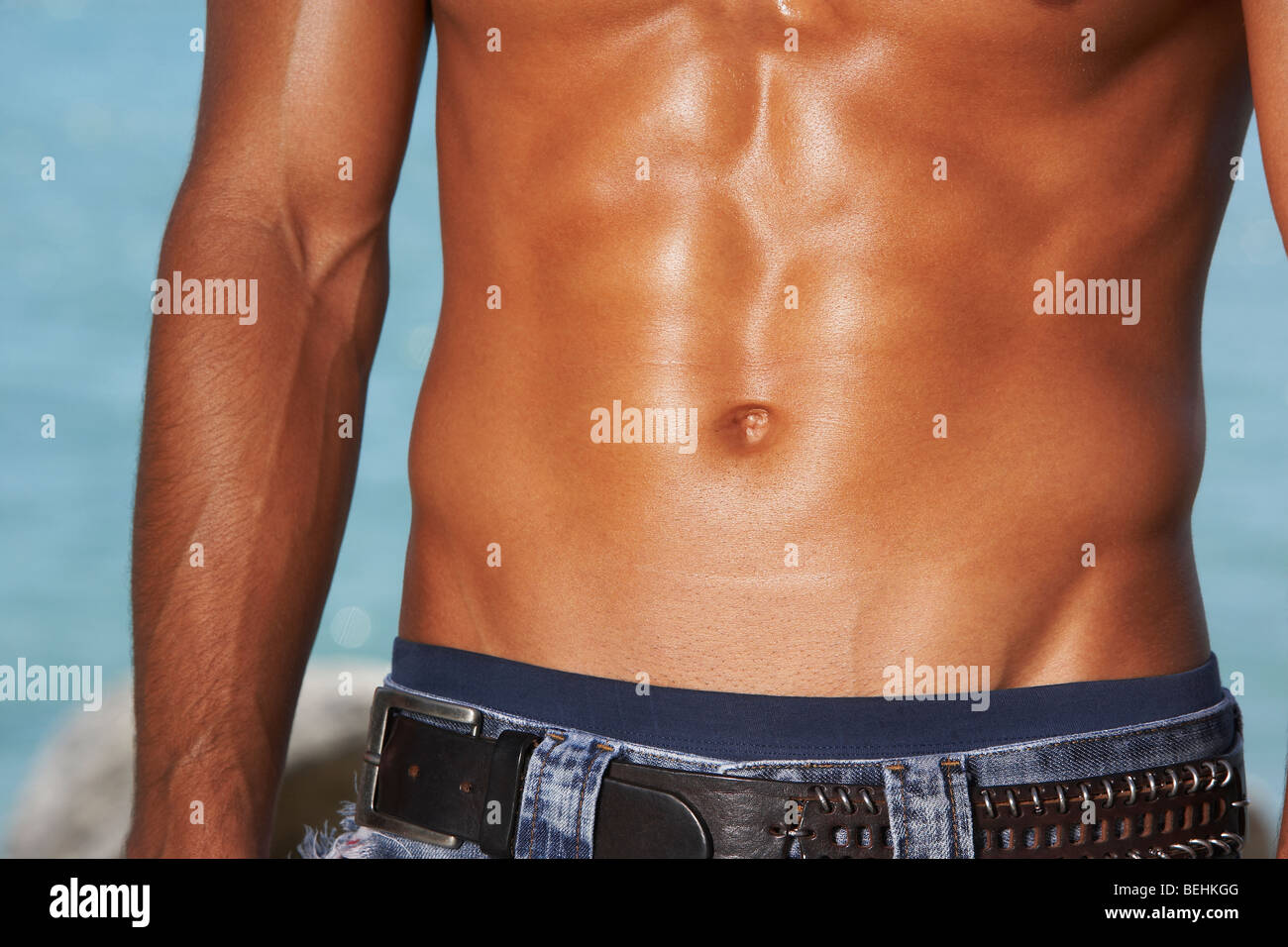 Mid section view of a bare chested young man Stock Photo - Alamy