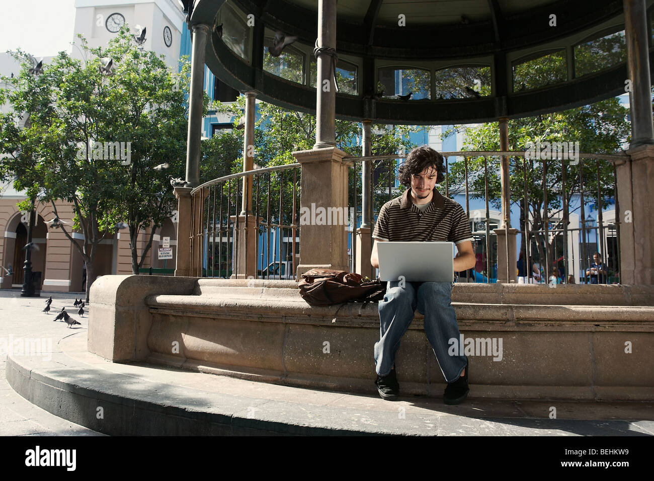 Young man using a laptop Stock Photo - Alamy