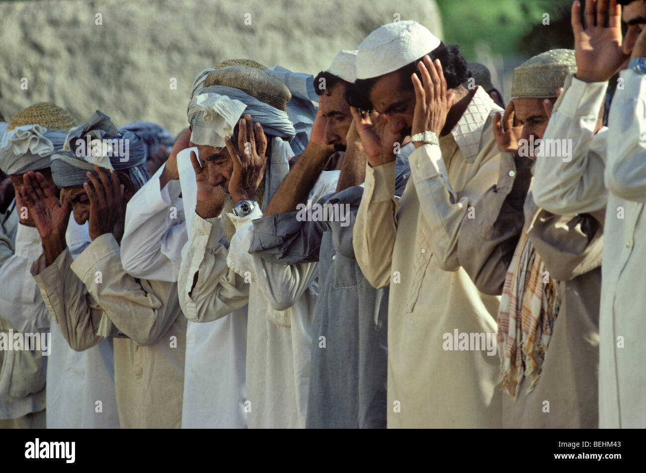 Pathan men praying at open-air mosque, Kado, Northwest Frontier ...