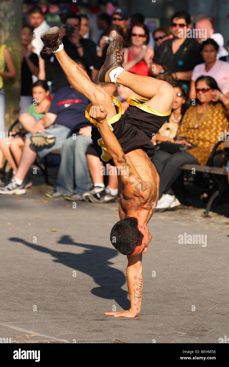 Acrobats in Battery Park New York. Street dances performing in the park ...