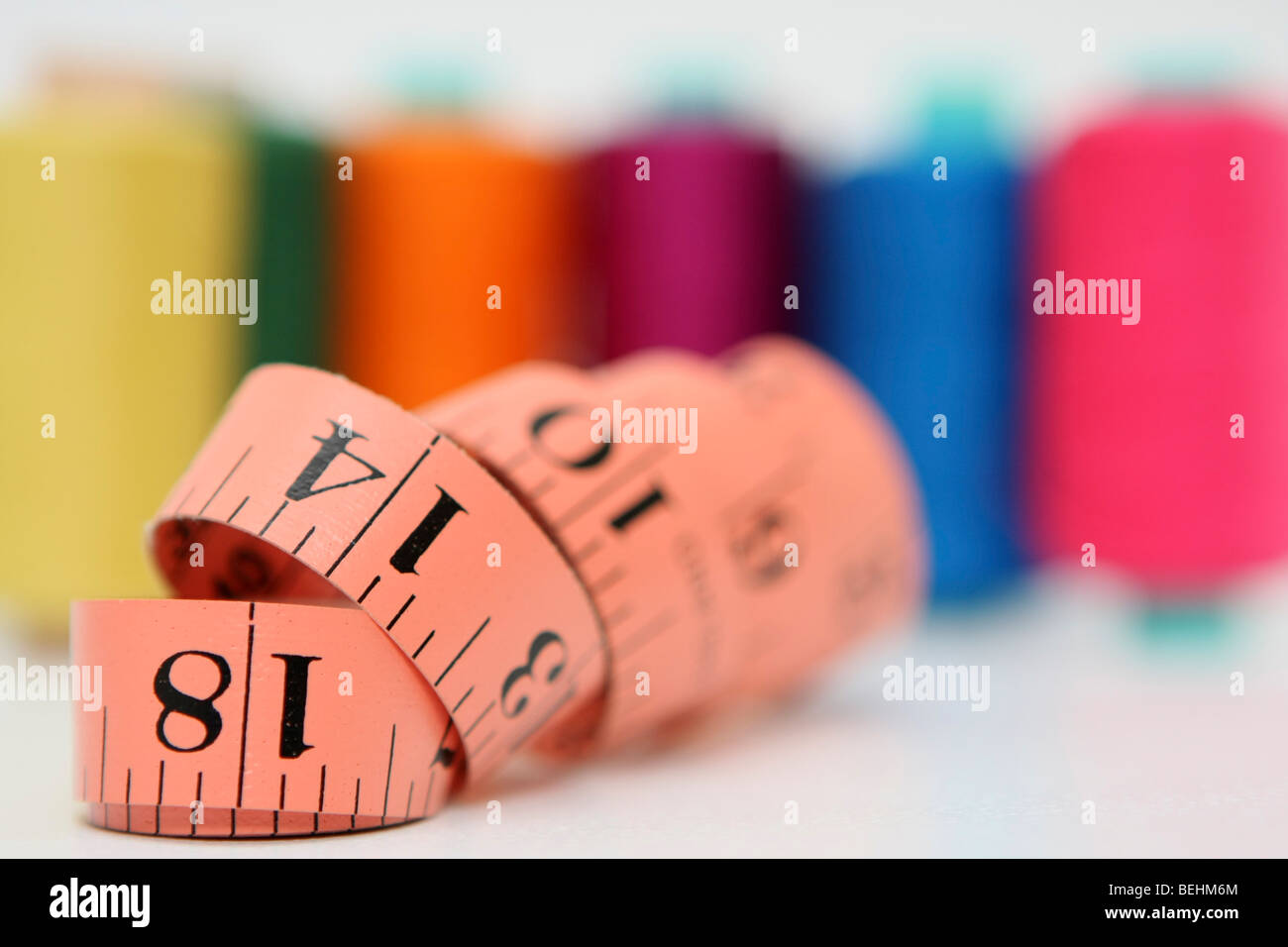 Sewing kit thread and measuring tape Stock Photo - Alamy