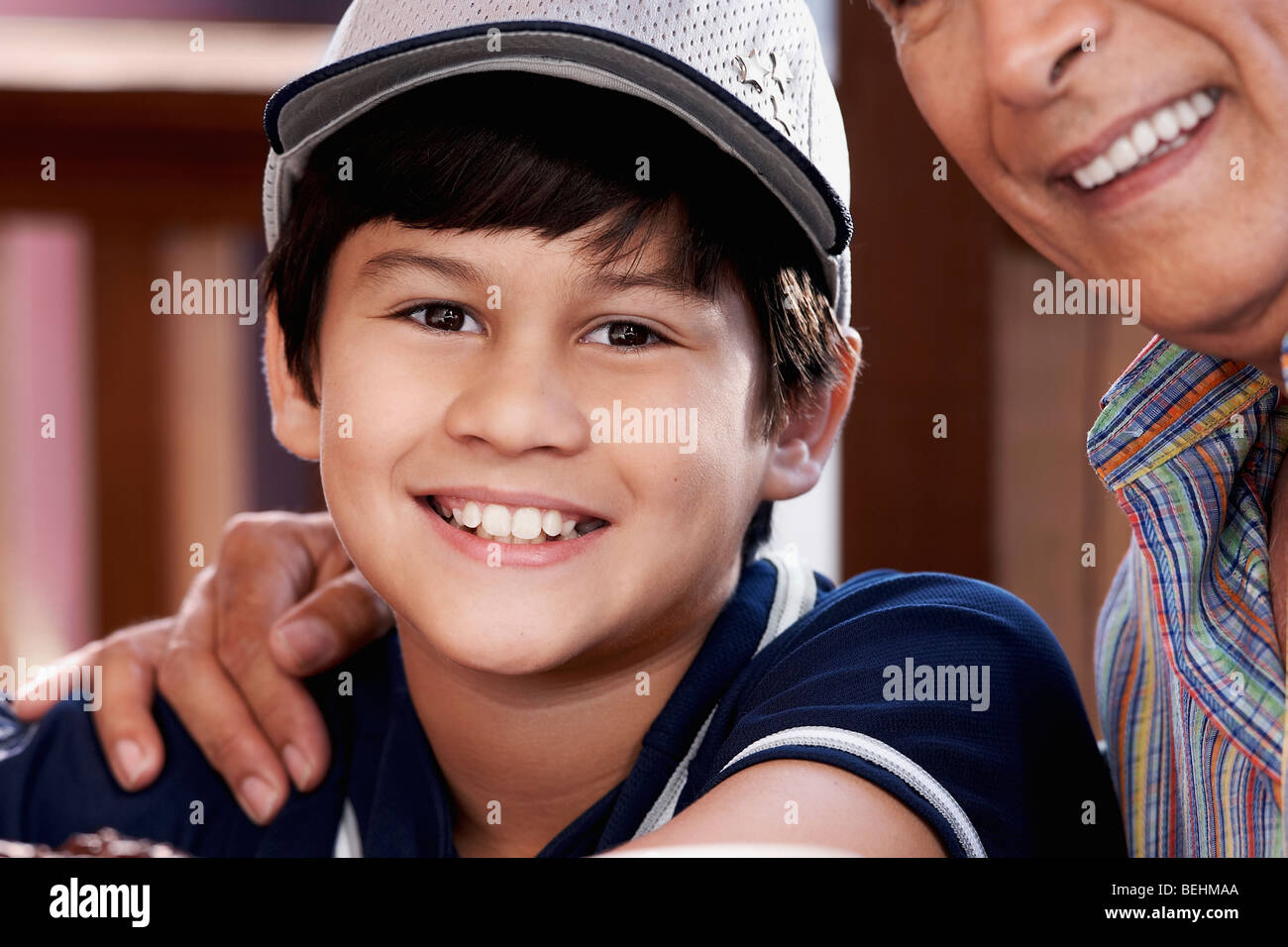 Portrait of a boy with his grandfather smiling Stock Photo - Alamy