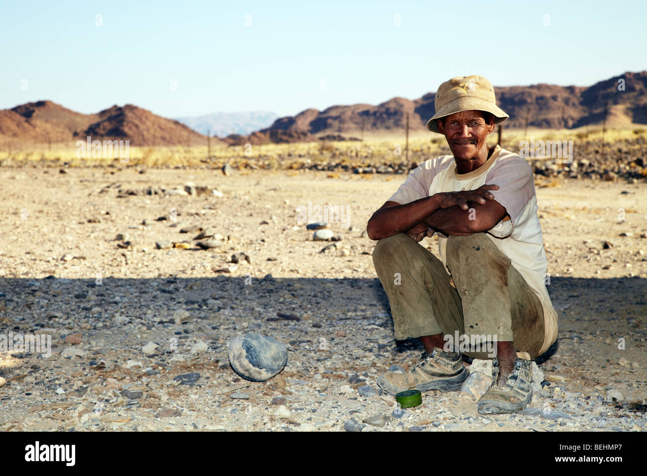 Namibian man, Namibian man sitting at roadside Stock Photo - Alamy