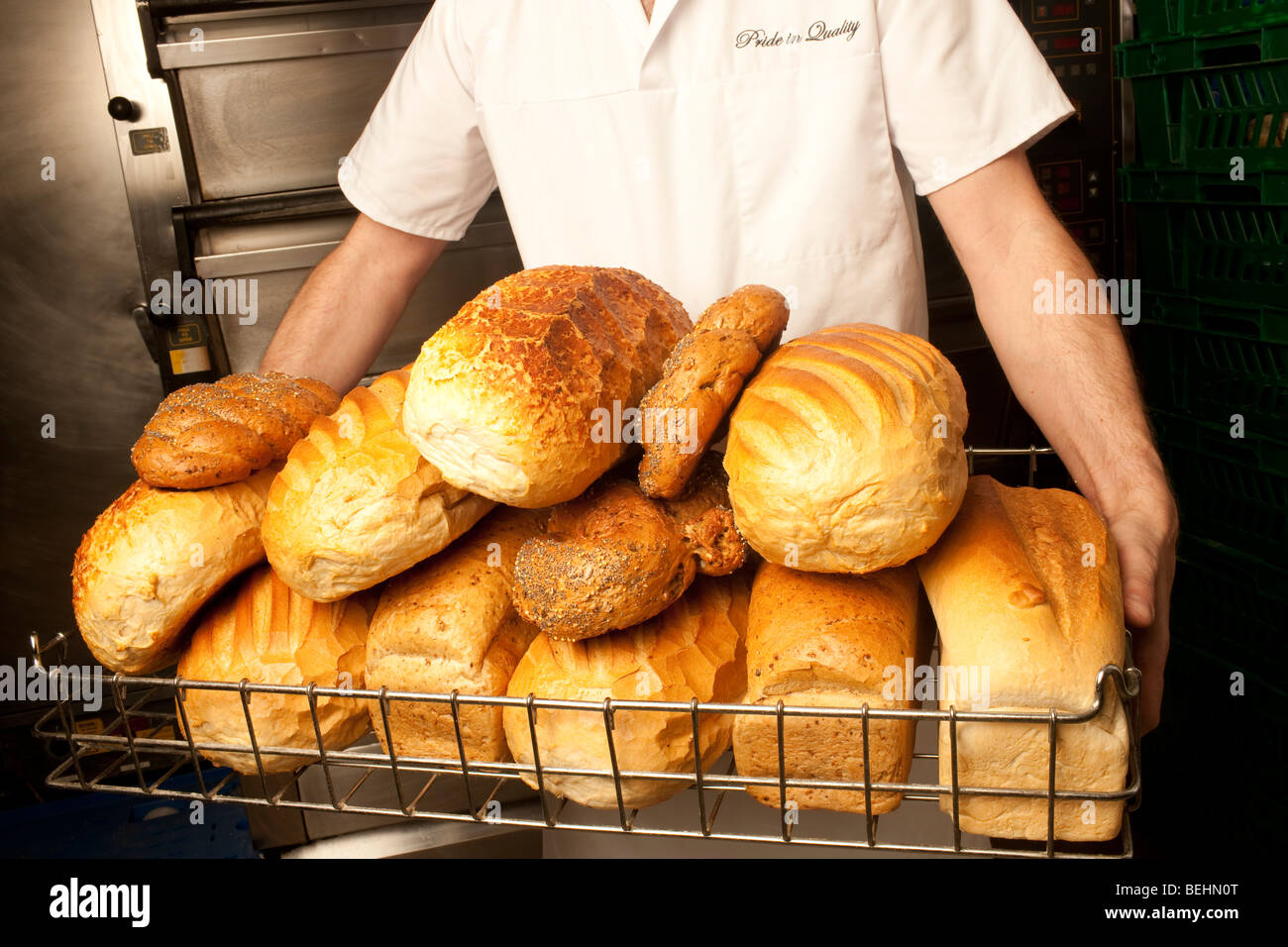 Baker holding tray of different breads Stock Photo - Alamy