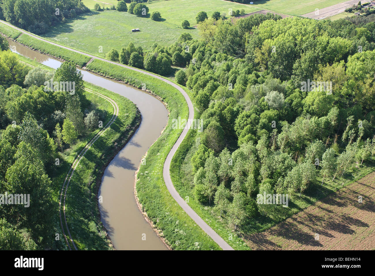 Fields, grasslands and forested area along river Demer, valley of Demer ...