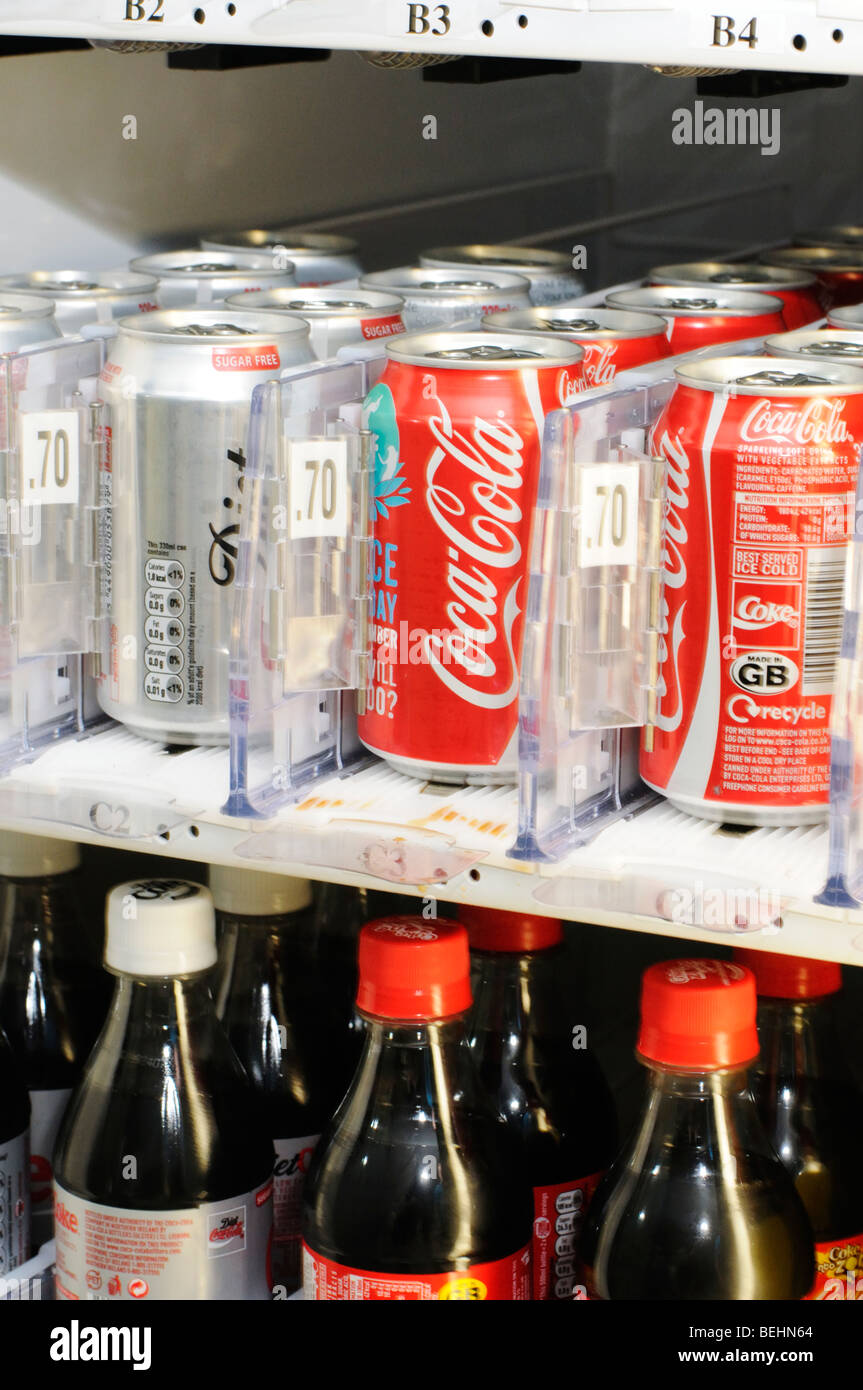 Cans and bottles of coke in a a vending machine Stock Photo - Alamy