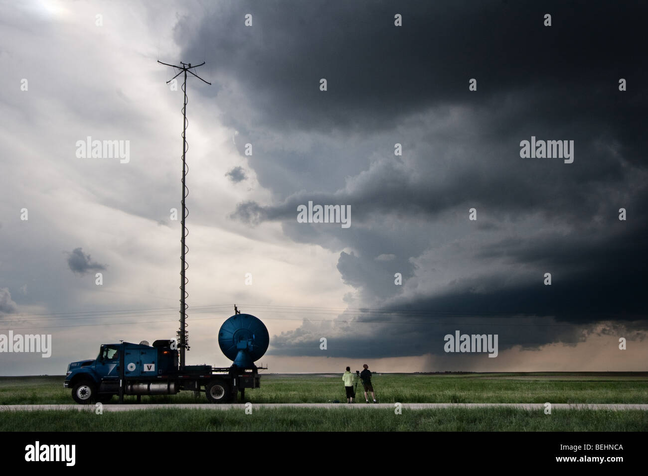 Storm chasers with Project Vortex 2 watch a distant wall cloud and ...