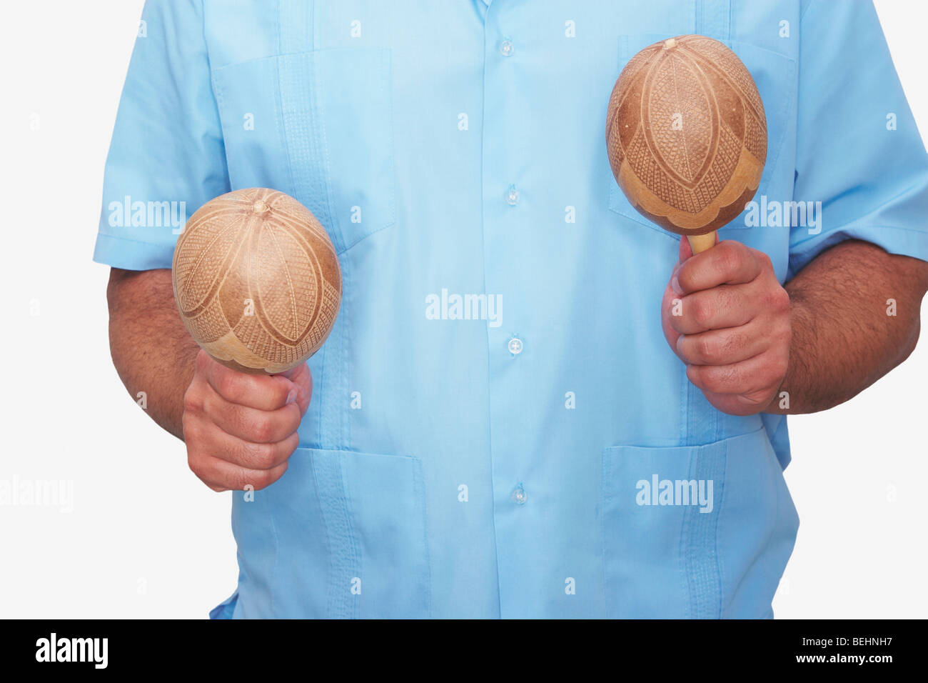 Mid section view of a man holding a pair of maracas Stock Photo - Alamy