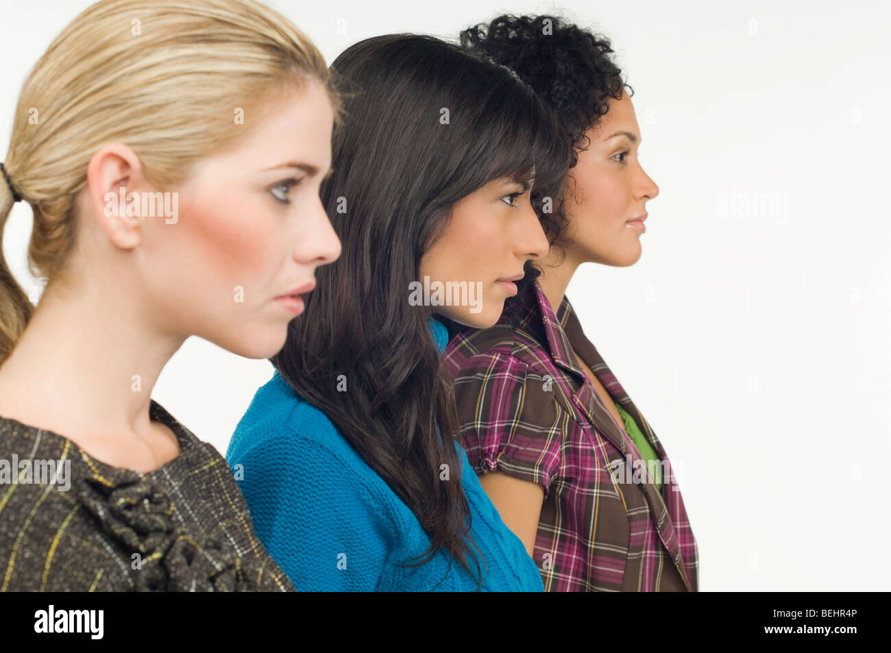 Three women in a row Stock Photo - Alamy