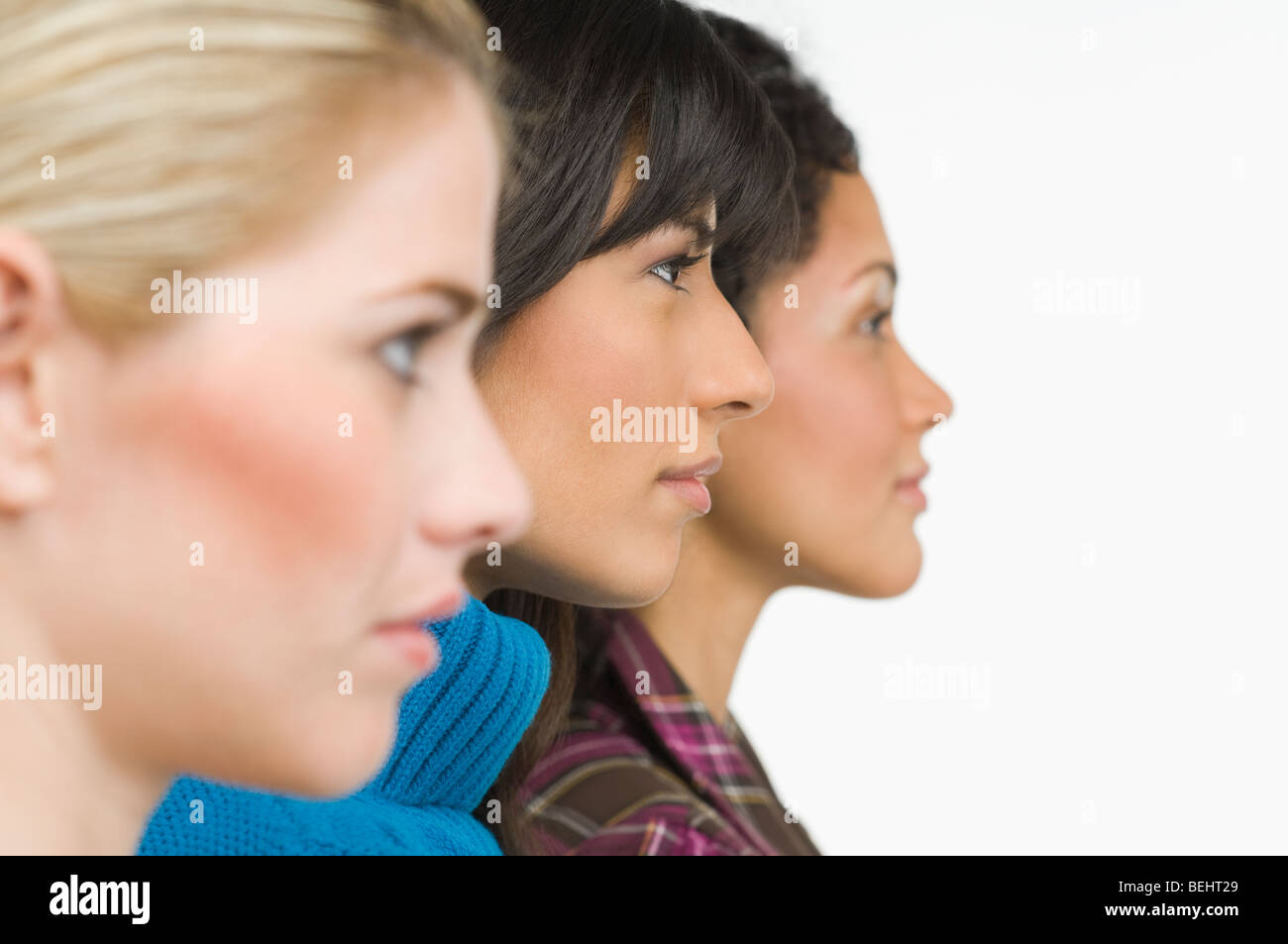 Three women in a row Stock Photo - Alamy