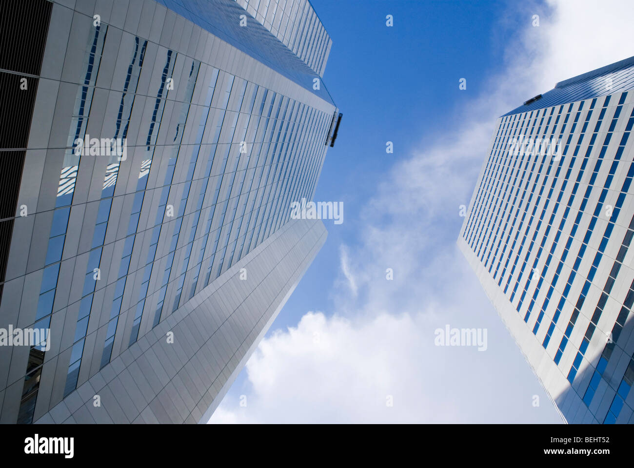 Looking up to the sky in between to high rise buildings in Montreal ...