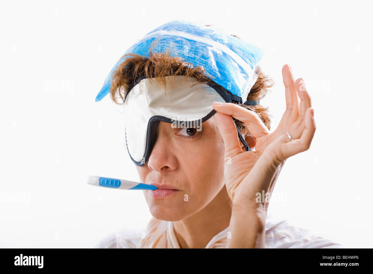 Woman checking her temperature Stock Photo - Alamy