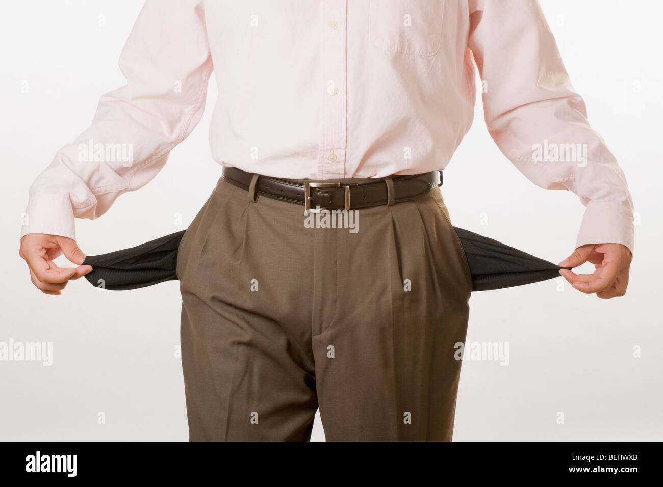 Man turning out his empty pockets Stock Photo - Alamy