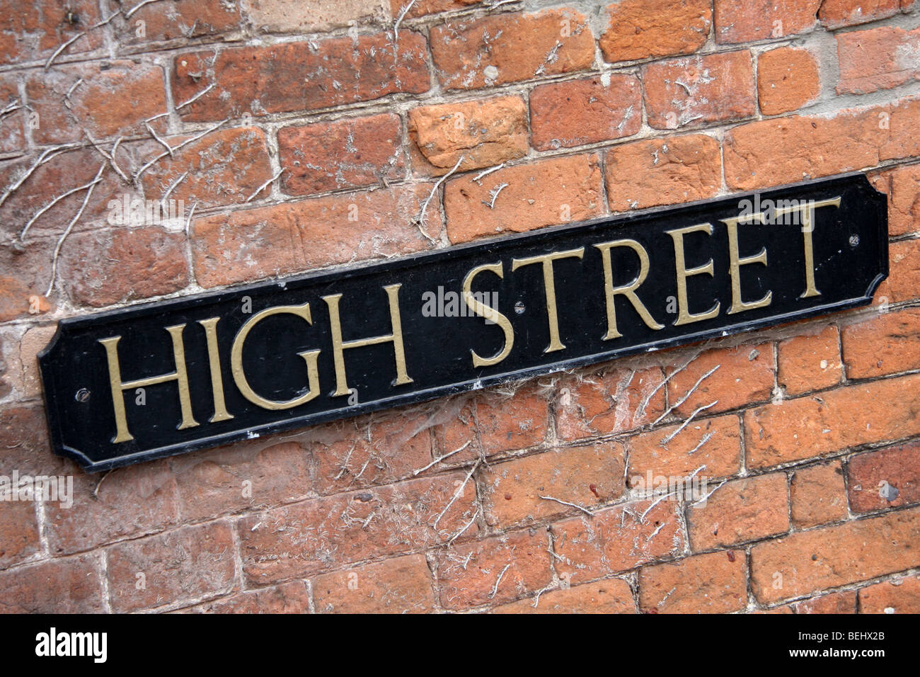 Street sign on brick wall Stock Photo - Alamy