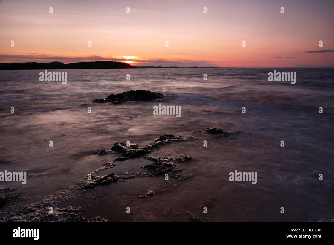 Dramatic Lake Superior summer orange sunset in Michigan USA from above ...