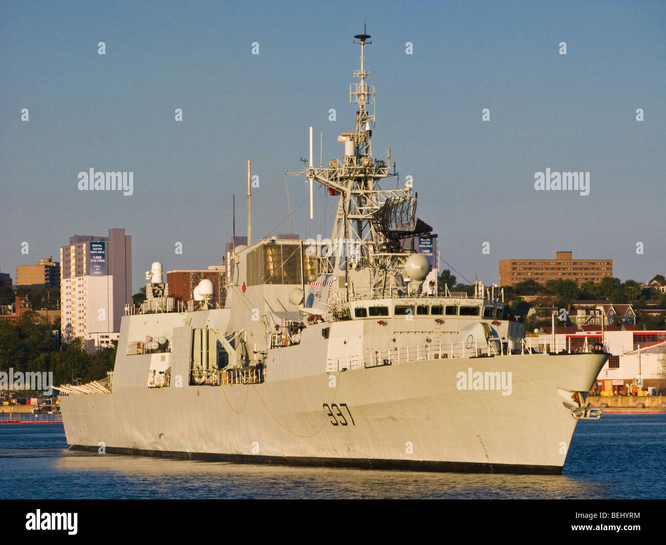 HMCS Fredericton in Halifax Harbour with HMC Dockyard in the background ...