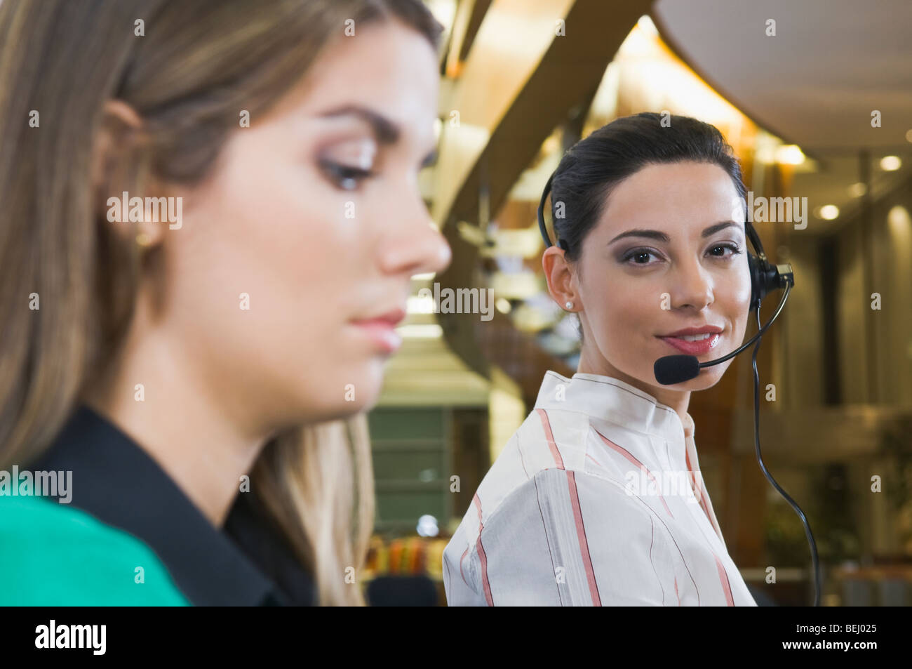 Two customer service representatives work hi-res stock photography and ...