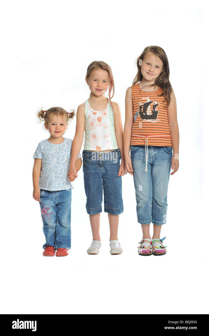 Three sisters standing,smiling Stock Photo - Alamy