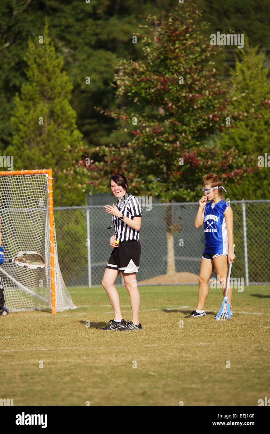 FEMALE REFEREE SHARES A LAUGH WITH PLAYERS HIGH SCHOOL GIRLS LACROSSE ...
