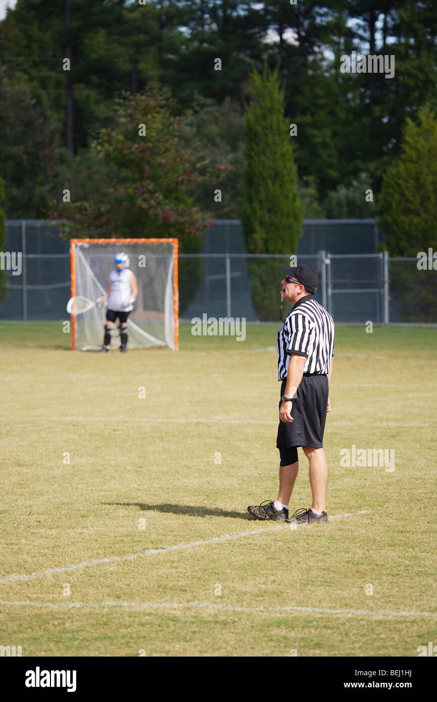 REFEREE KEEPING AN EYE ON THE ACTION HIGH SCHOOL GIRLS LACROSSE KEVIN ...