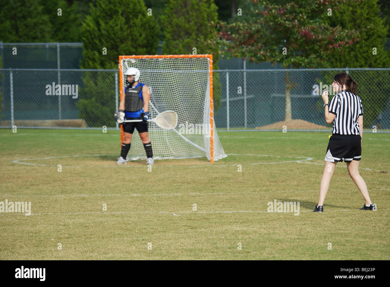 FEMALE REFEREE KEEPS AN EYE ON THE ACTION HIGH SCHOOL GIRLS LACROSSE ...