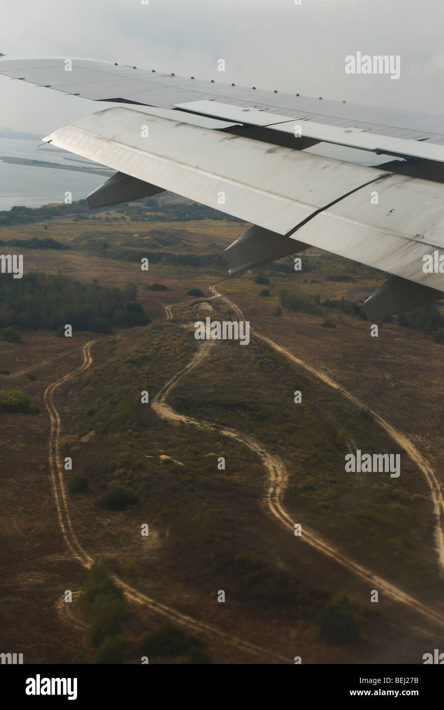 Aerial view of an airplane flying over a landscape Stock Photo - Alamy