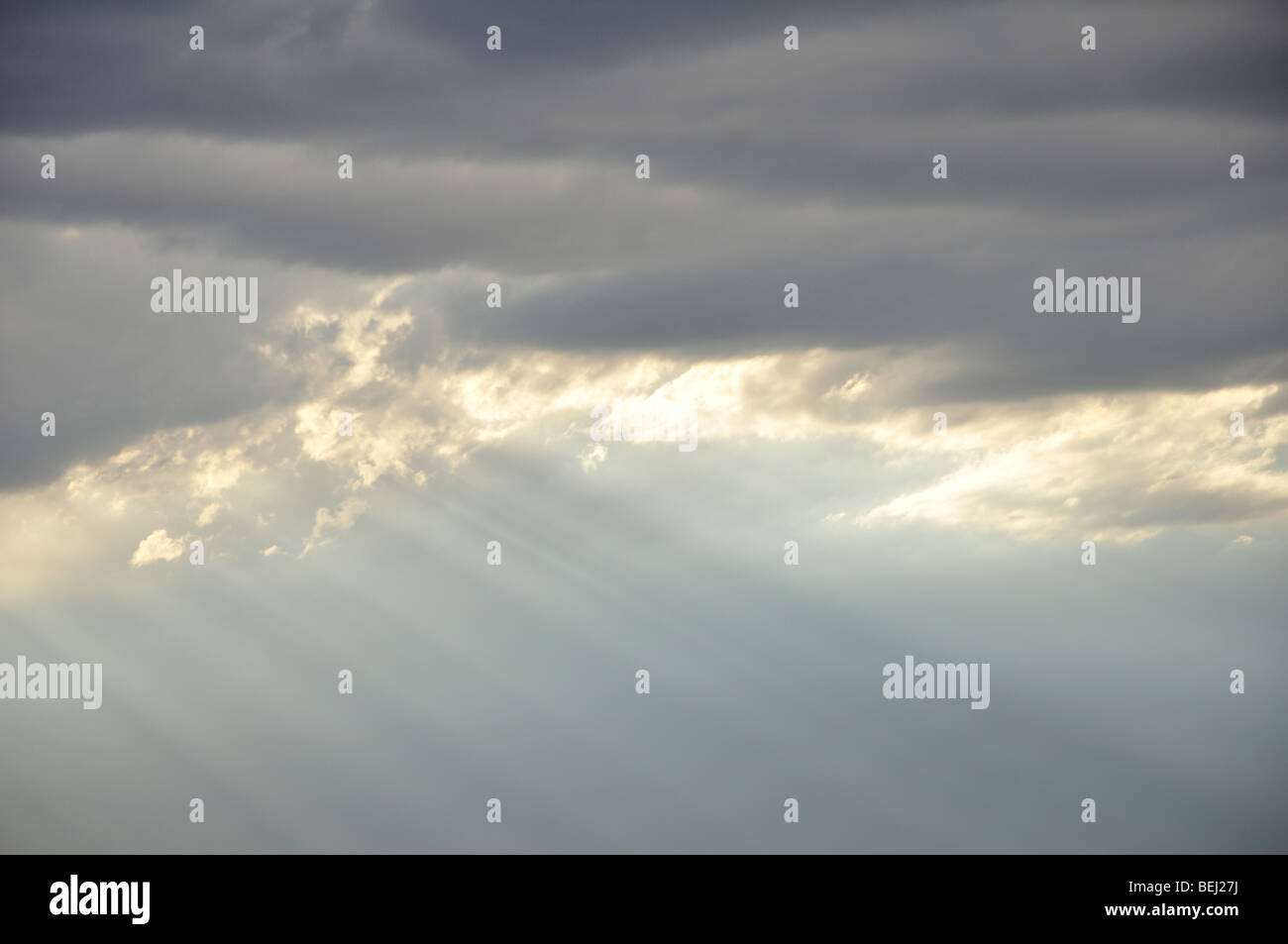 Sun rays through clouds Stock Photo - Alamy