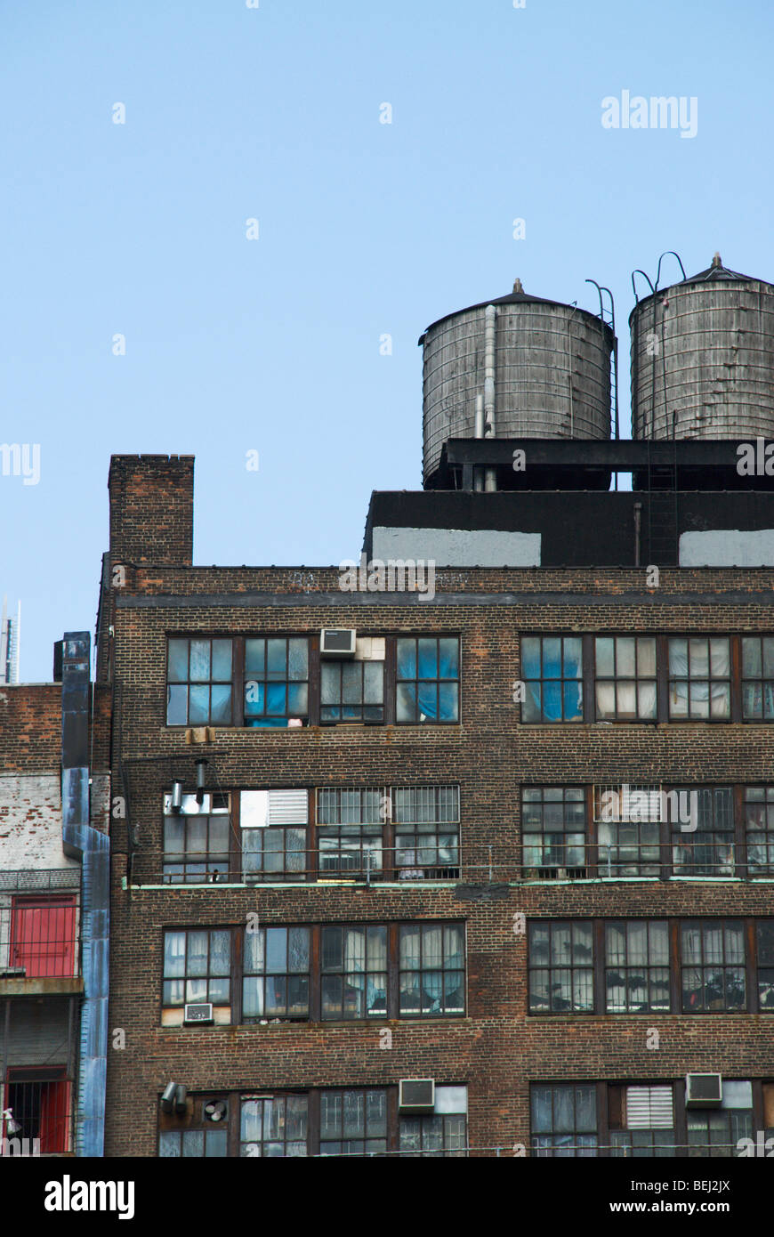 Low angle view of water tanks on an apartment building Stock Photo - Alamy