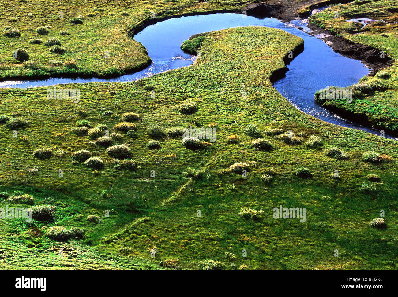 Curling river in valley, Iceland Stock Photo - Alamy