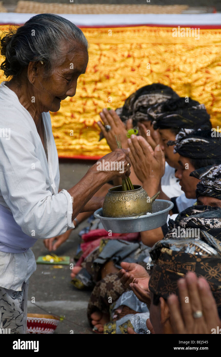 praying at temple during a local festival in Bali Indonesia Stock Photo ...
