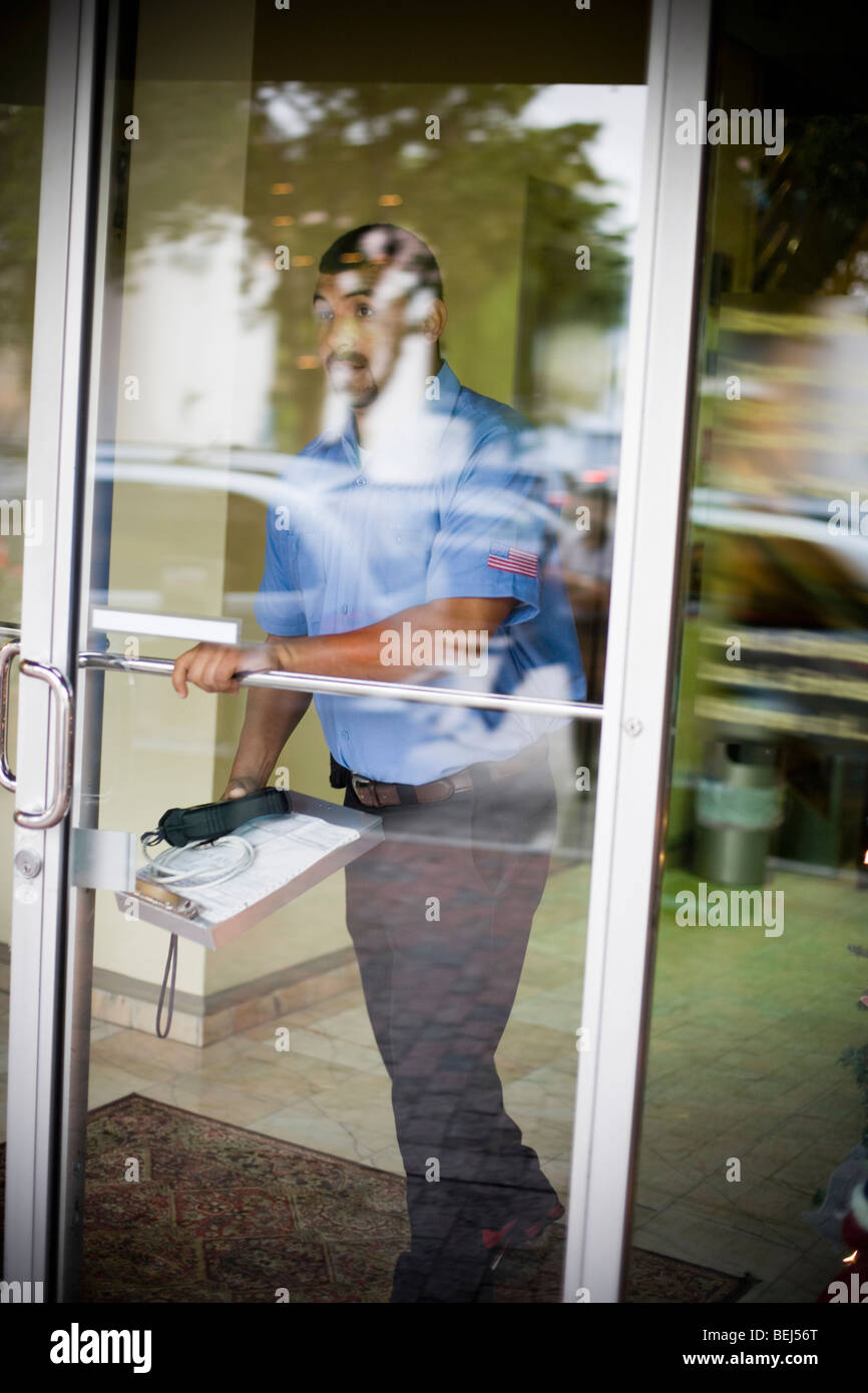 Cable man walking out of building outdoors Stock Photo - Alamy