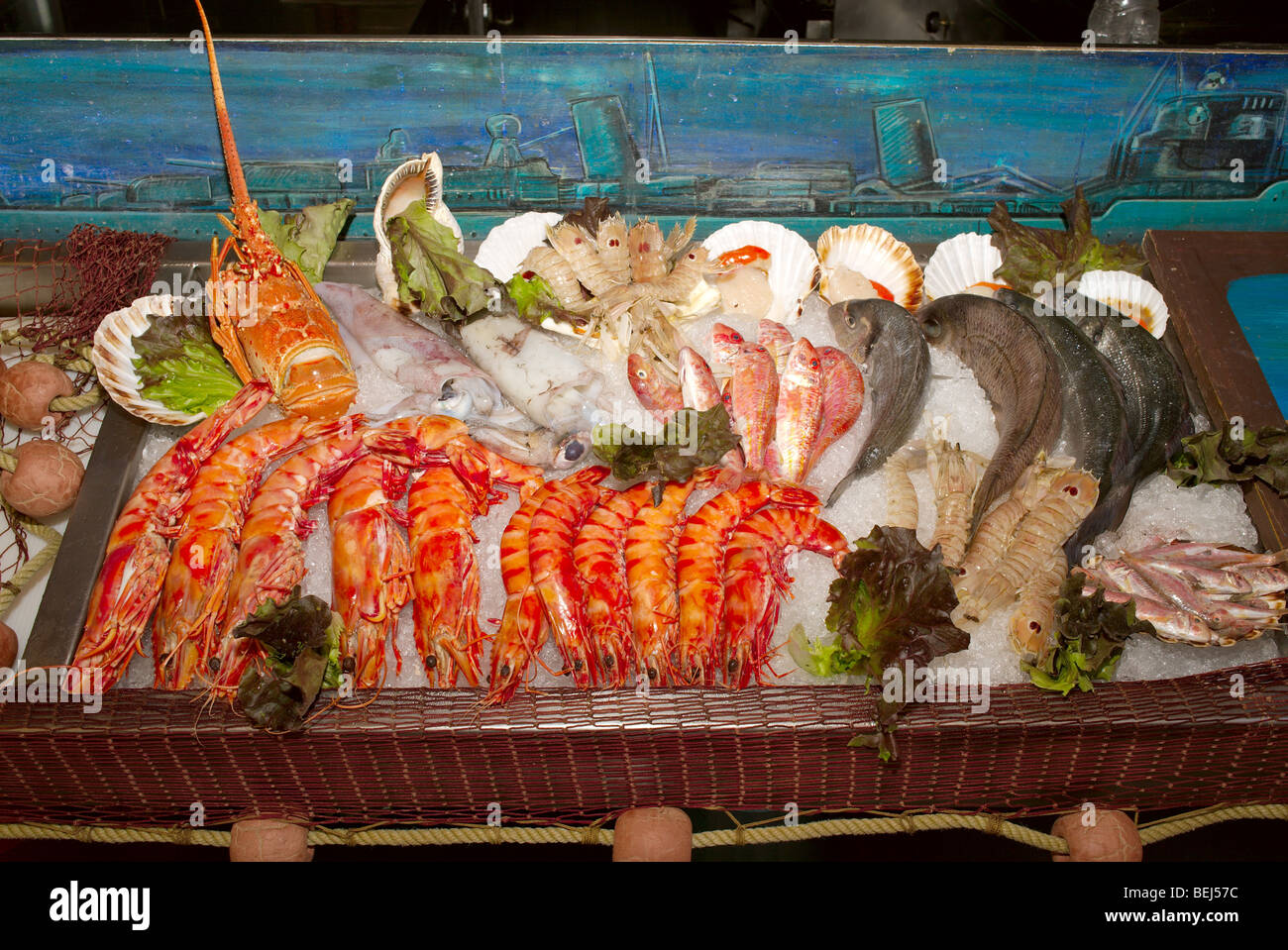 Assorted seafood on a bed of ice including fish giant shrimp lobster ...