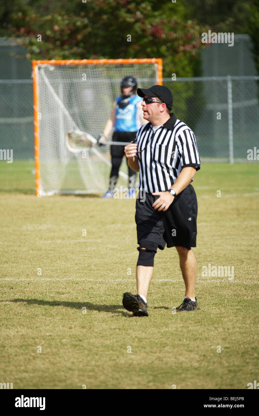 REFEREE KEEPING AN EYE ON THE ACTION HIGH SCHOOL GIRLS LACROSSE KEVIN ...