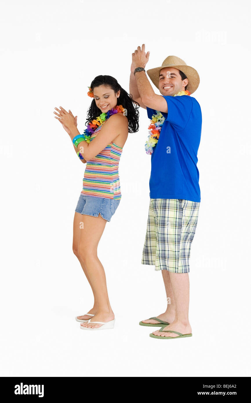 Side profile of a young couple dancing and clapping Stock Photo - Alamy