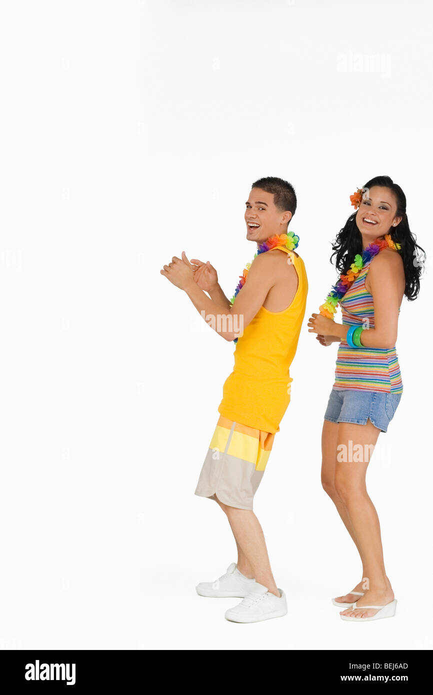 Side profile of a young couple dancing and clapping Stock Photo - Alamy