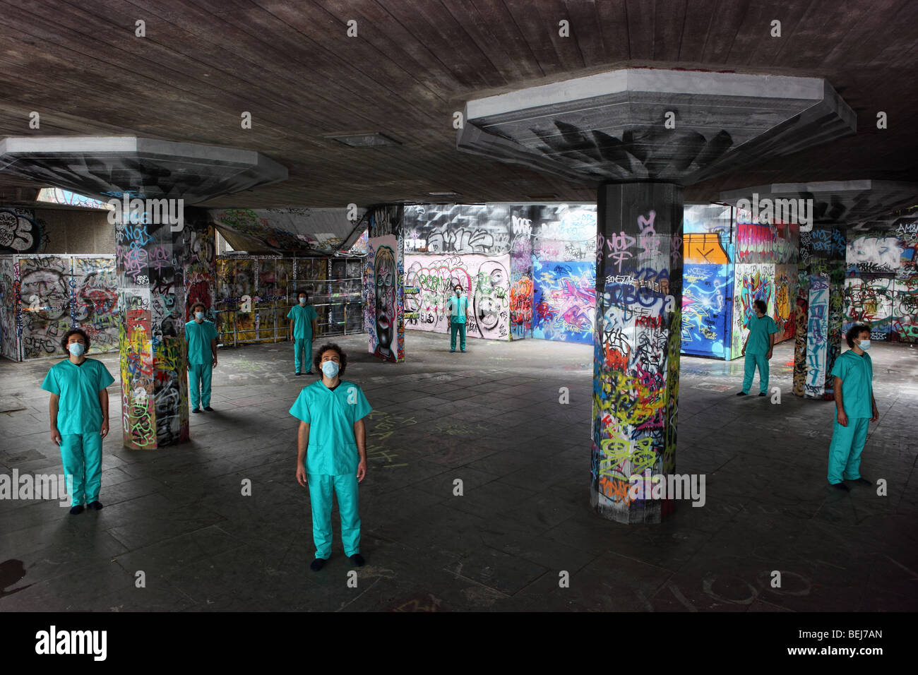 Surgical mask men in graffiti underground place Stock Photo - Alamy