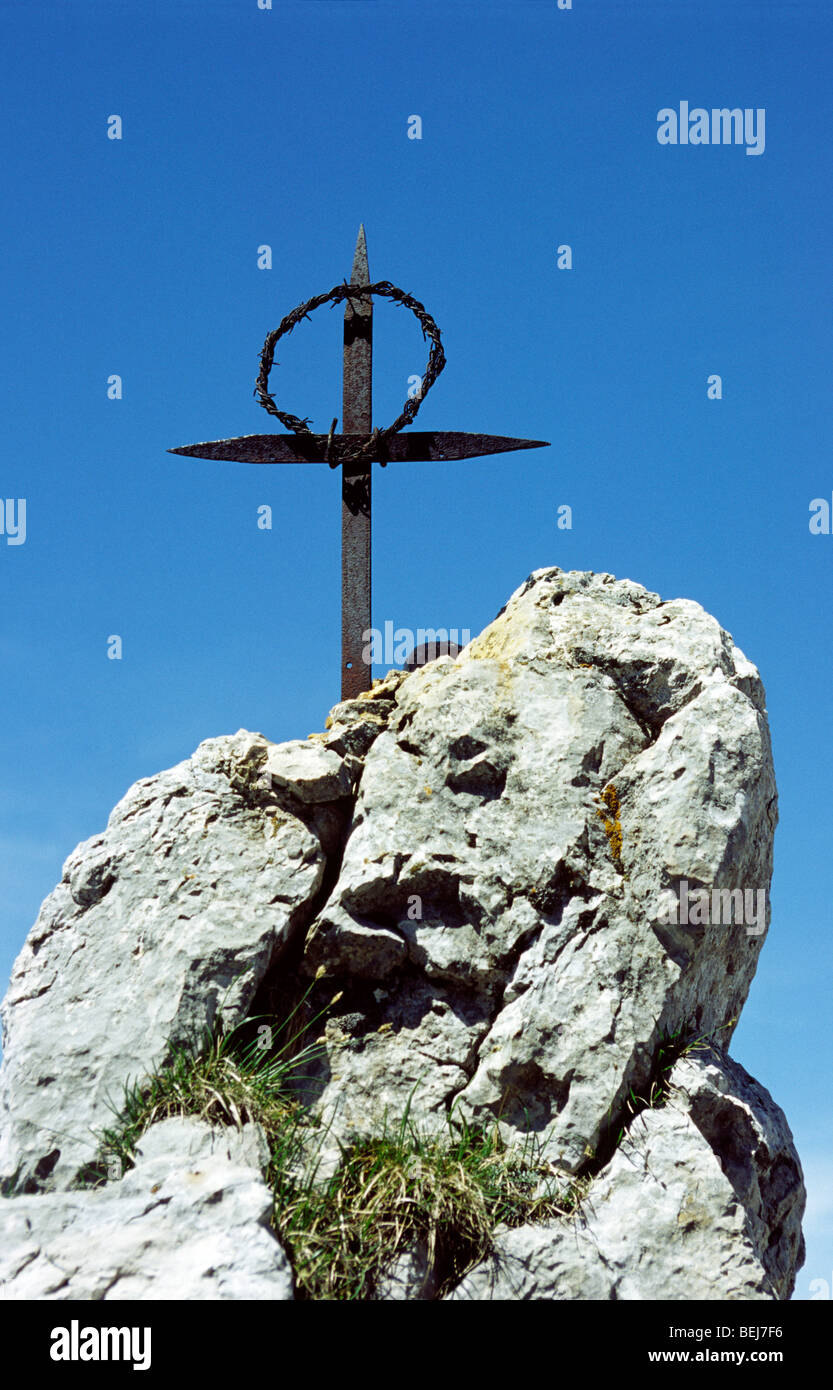 Cross made from WWI rusting iron and barbed wire on the mountain ...